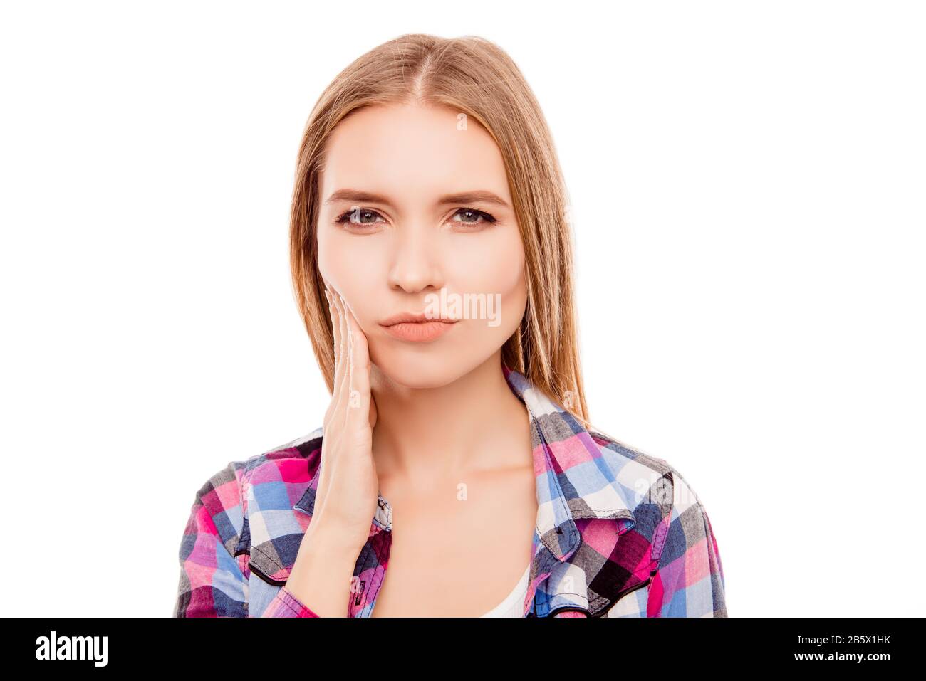 Portrait of sad woman having toothache and touching cheek Stock Photo ...