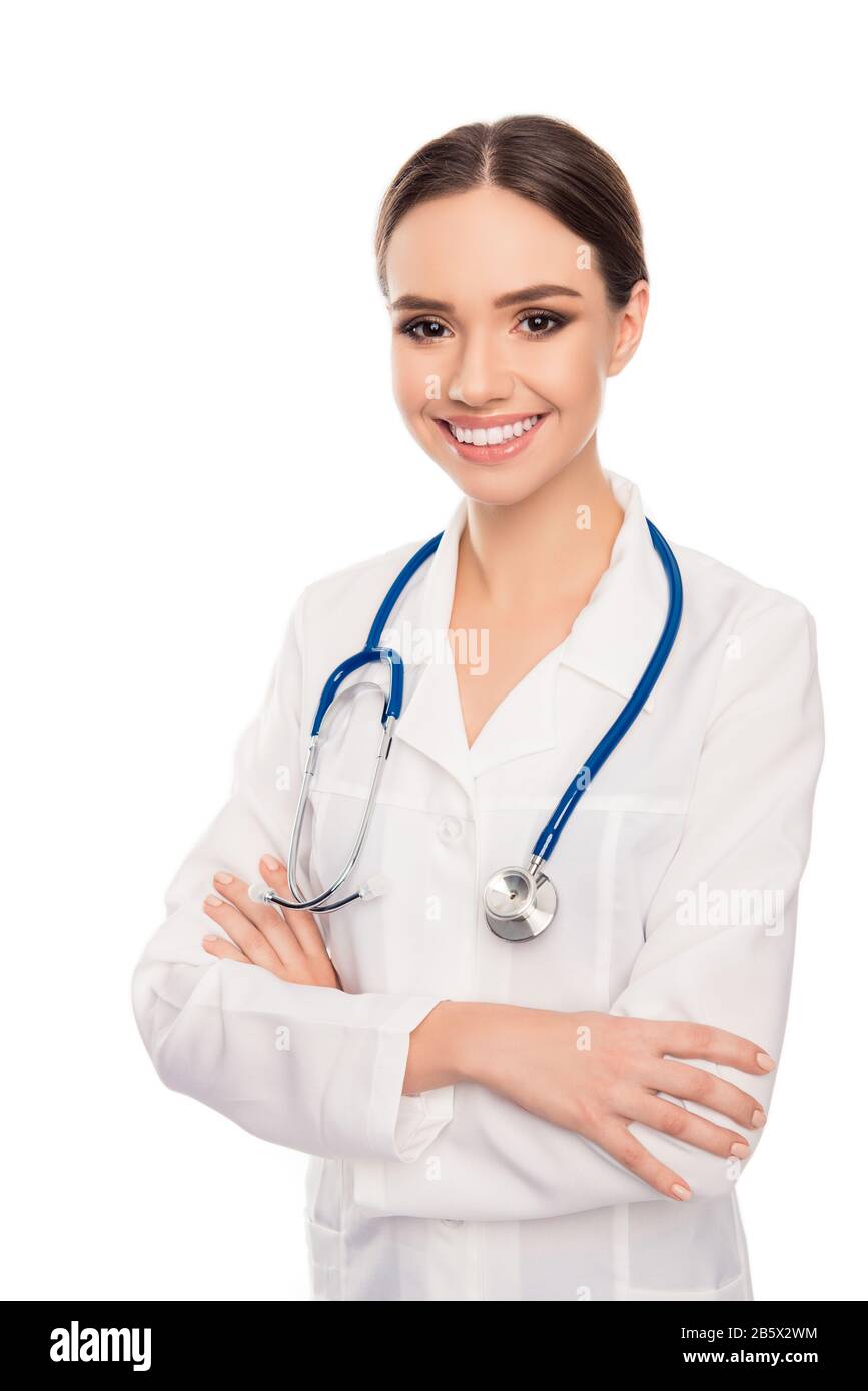 Portrait of pretty female doctor with beaming smile and crossed hands ...