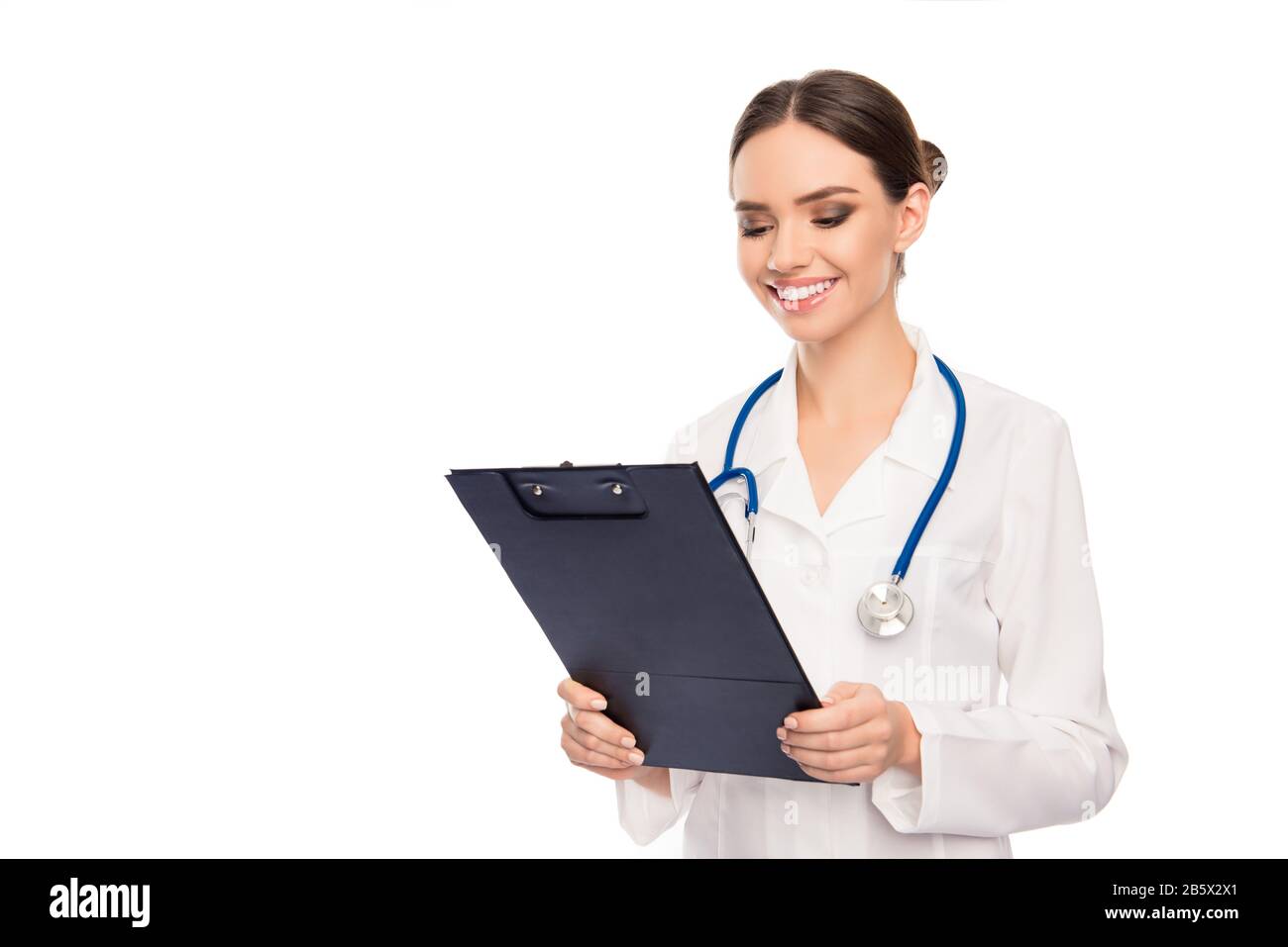 Young pretty smiling female doc holding folder with diagnosis Stock ...