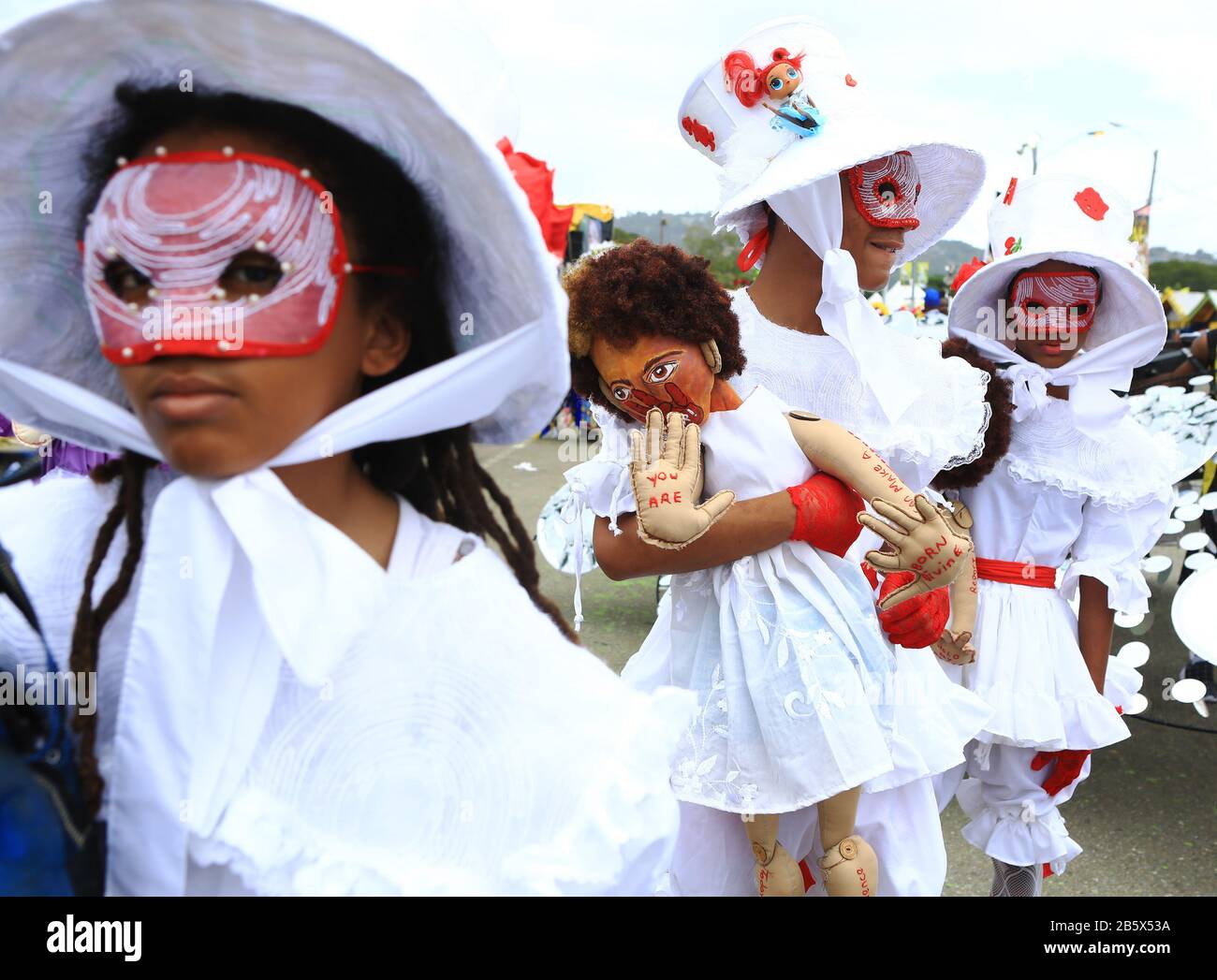 PORT OF SPAIN, TRINIDAD - FEB 24: Traditional Baby Doll masqueraders ...