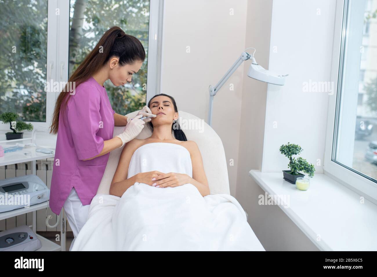 Beauty doctor working hard while doing injections for client Stock ...