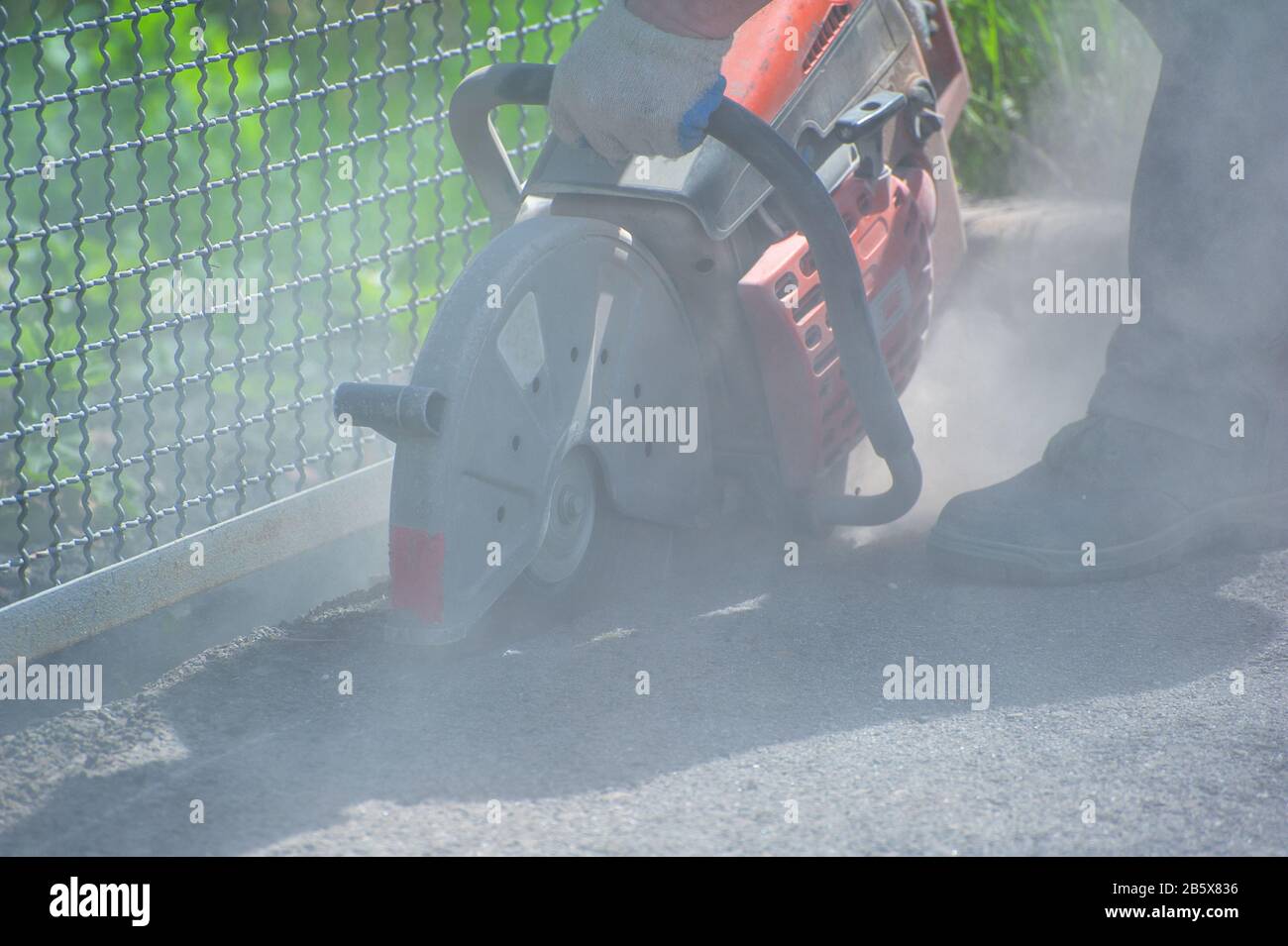 The joint cutter machine on a brushed concrete surface. Construction ...