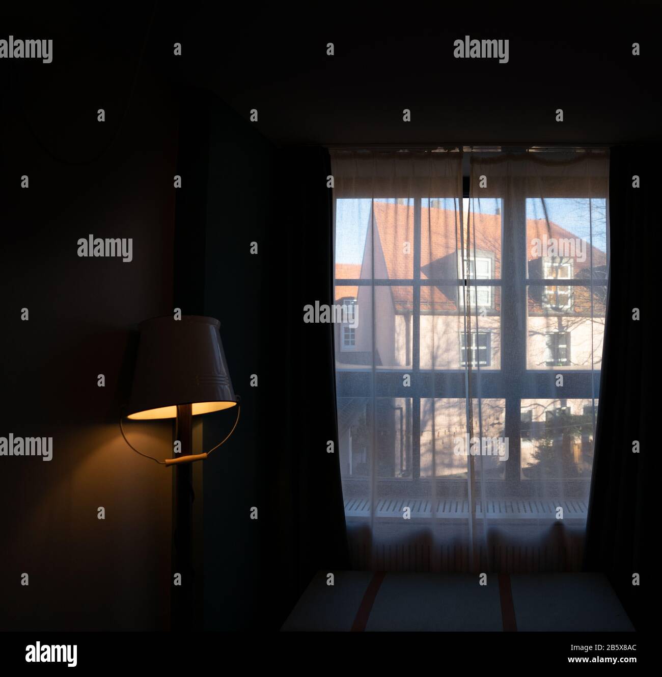 Electric lamps on the fin of the window in the German interior. Munich ...