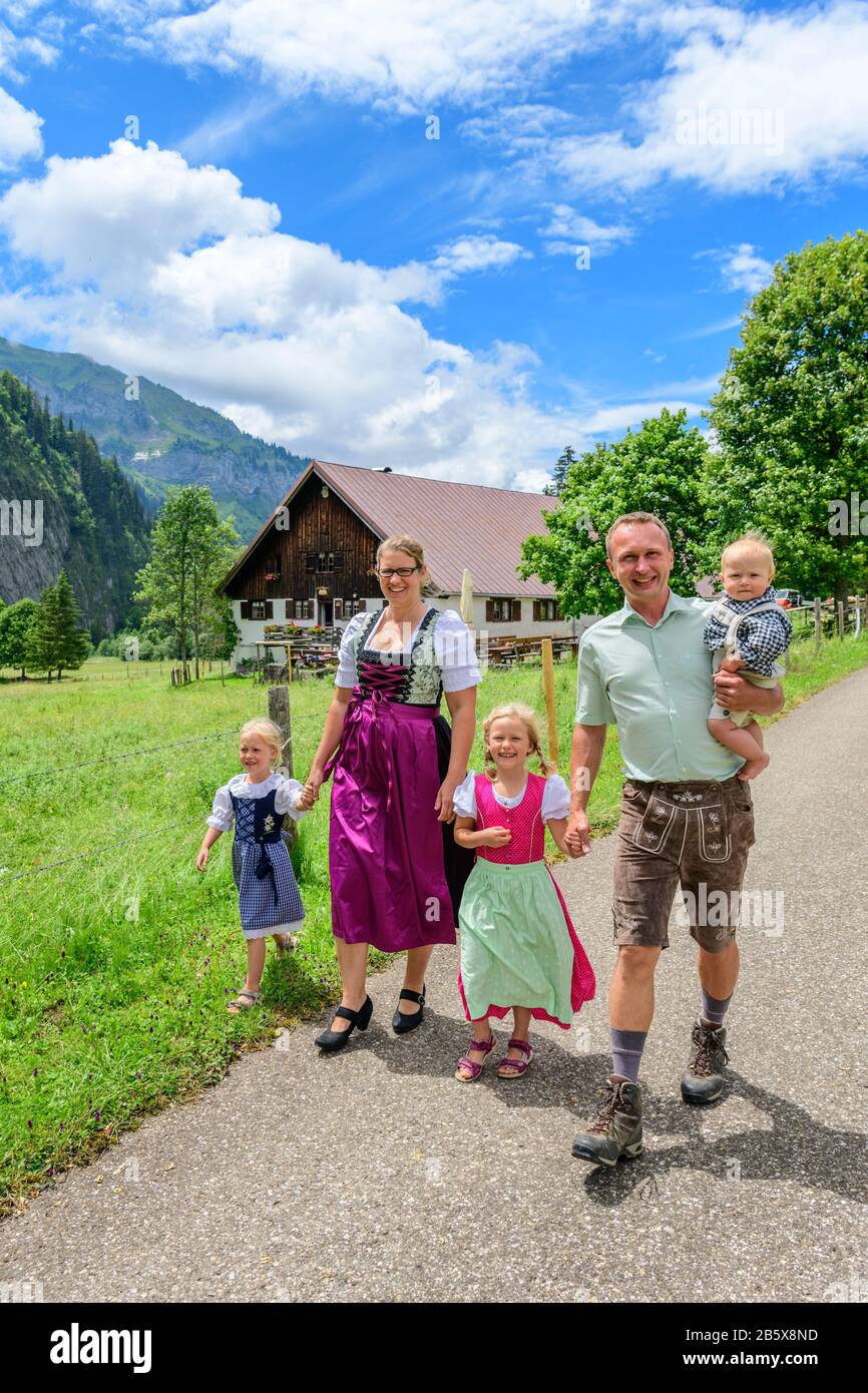 Family excursion in traditional clothing Stock Photo - Alamy