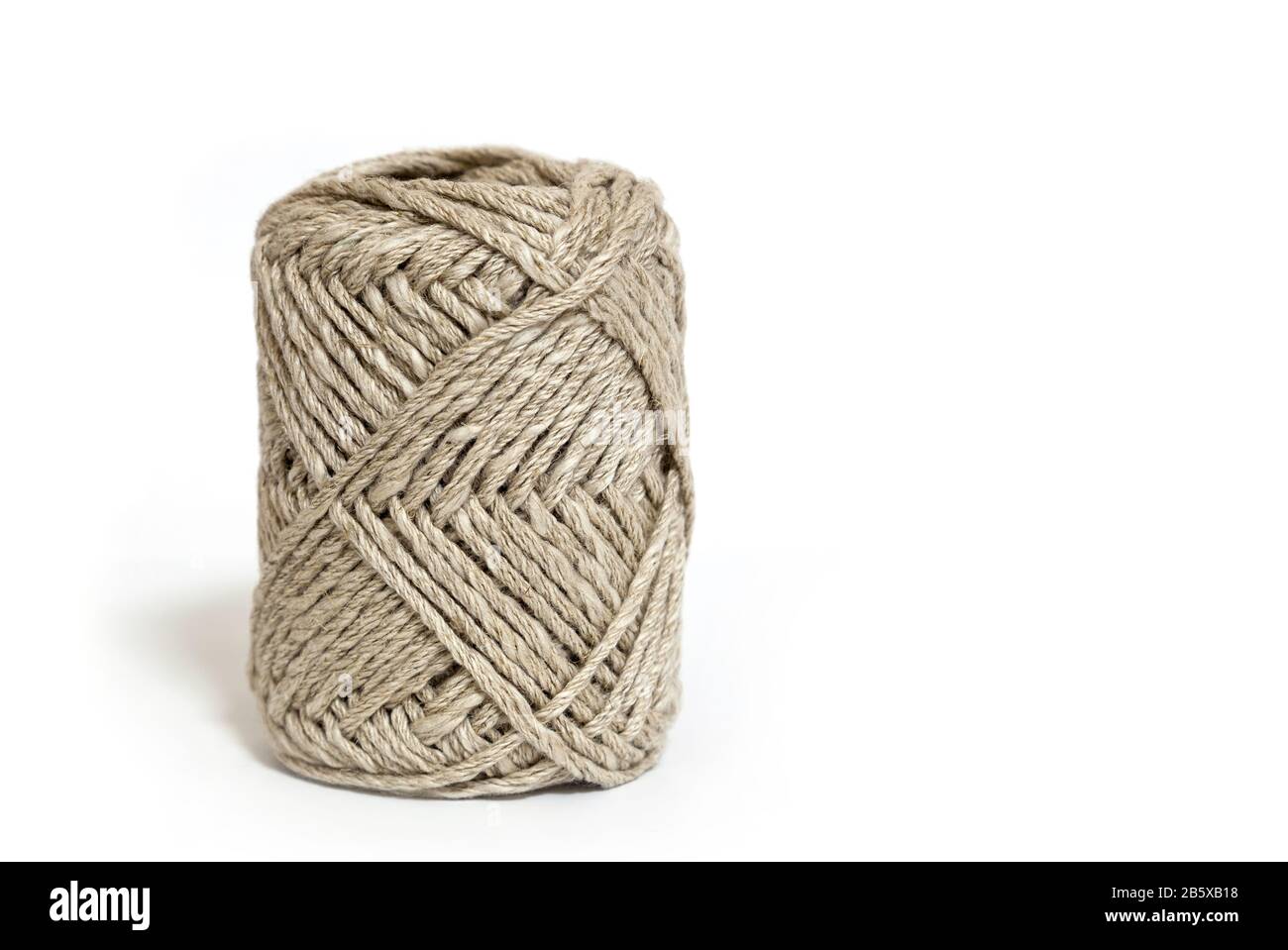 Ball of brown yarn on white background Stock Photo - Alamy