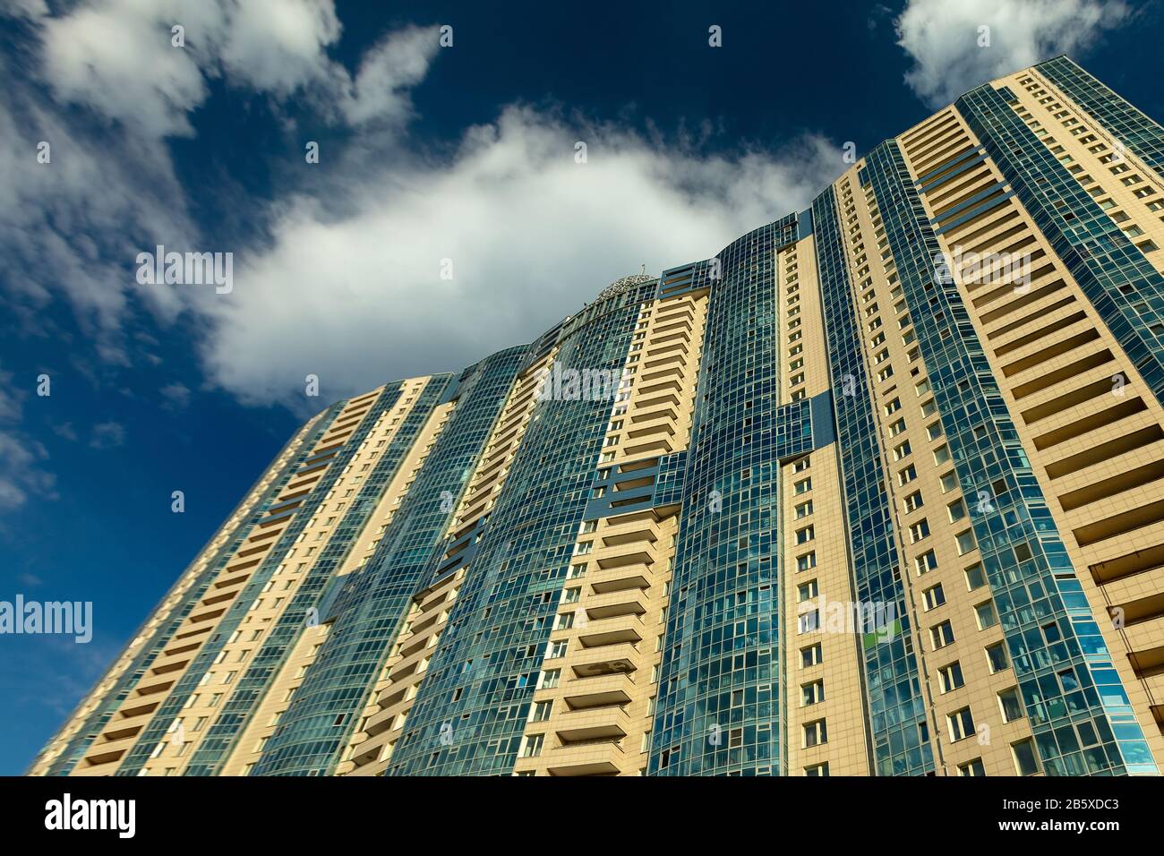 Modern building exterior low angle view with blue sky and clouds Stock ...