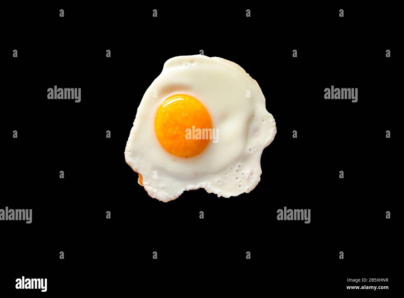 sunny side up with black background Stock Photo - Alamy