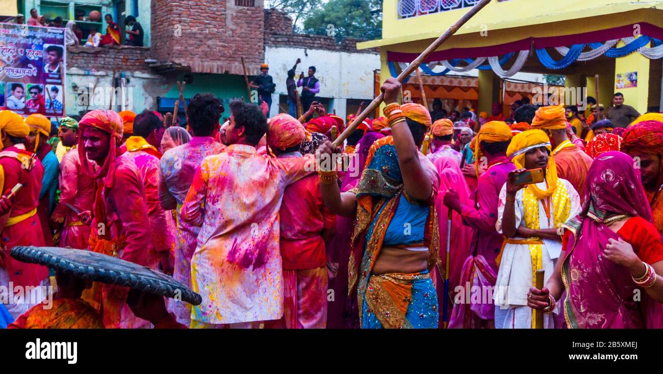 People celebrating lathmar holi in nand gaon Stock Photo - Alamy