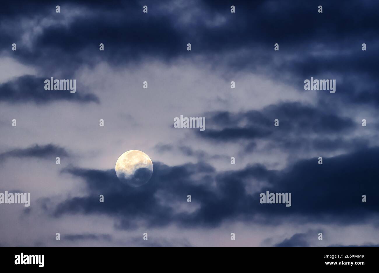 Moonrise in an African sky. Full moon over Amboseli National Park ...