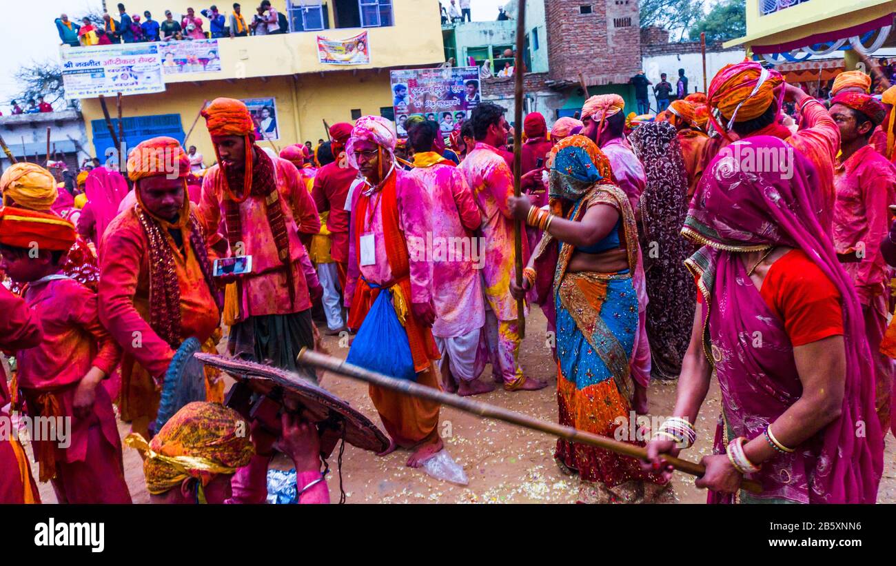 People celebrating lathmar holi in nand gaon Stock Photo - Alamy