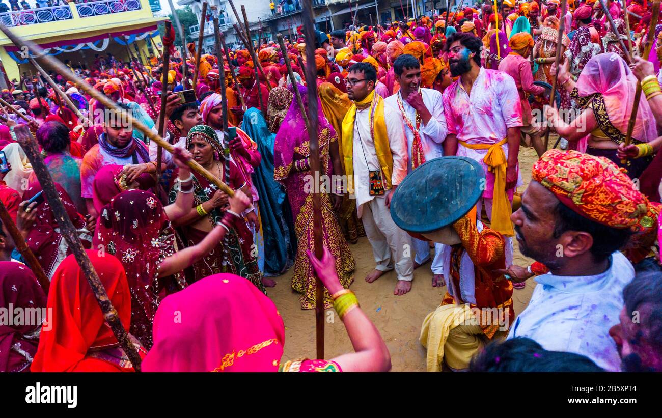 People celebrating lathmar holi in nand gaon Stock Photo - Alamy