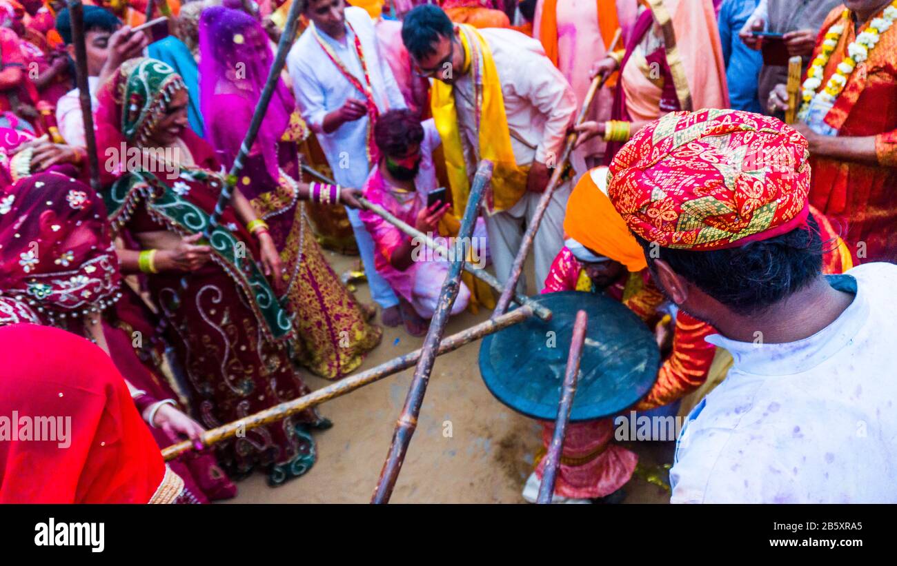 People celebrating lathmar holi in nand gaon Stock Photo - Alamy