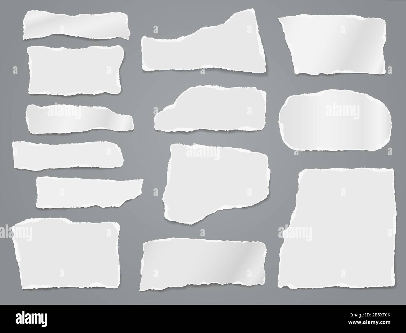 Torn white note, notebook paper strips, pieces stuck on dark grey ...