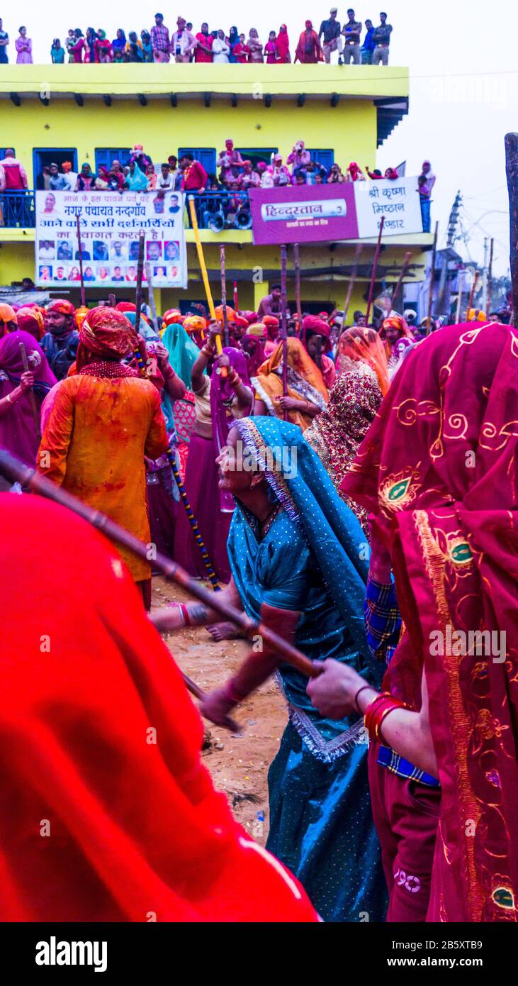 People celebrating lathmar holi in nand gaon Stock Photo - Alamy
