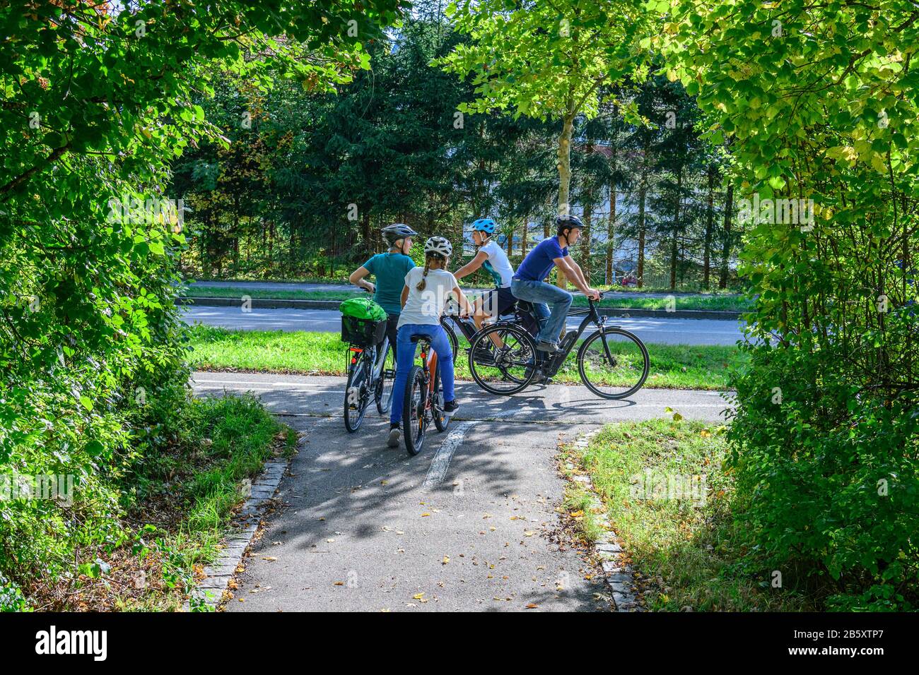 Cyclists on the way on bicycle road Stock Photo - Alamy