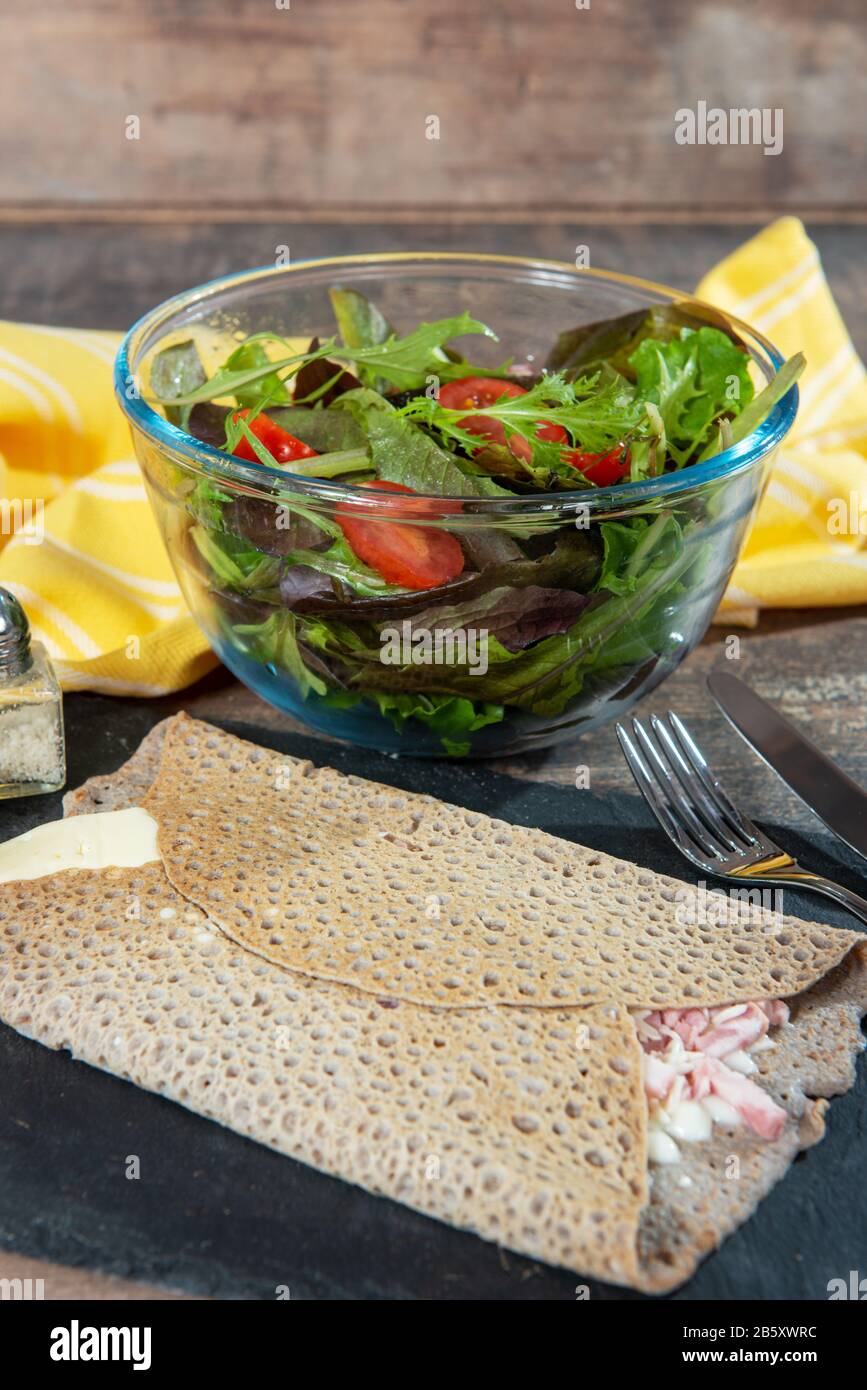 Breton crepe with cheese and bacon on the wooden background Stock Photo ...