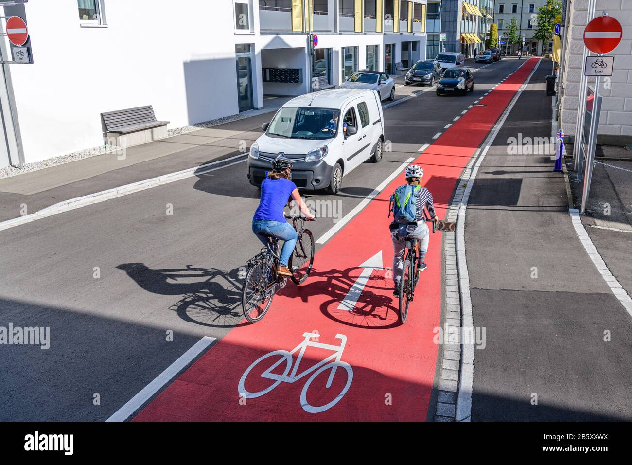 Cyclists using special cycling road on one-way-street Stock Photo - Alamy