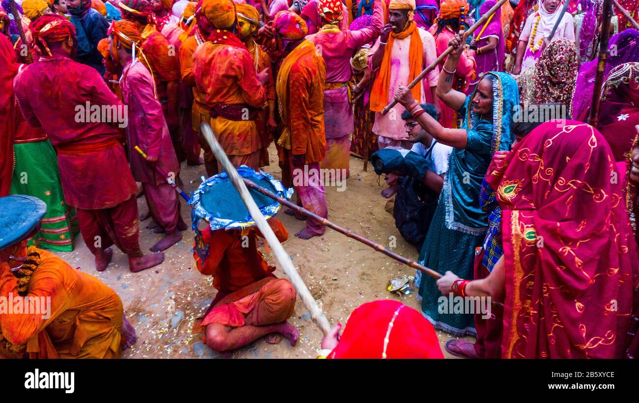 People celebrating lathmar holi in nand gaon Stock Photo - Alamy