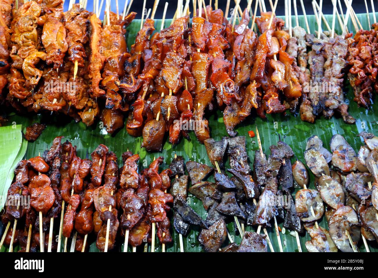 Photo of assorted chicken and pork innards in barbecue sticks sold at a ...