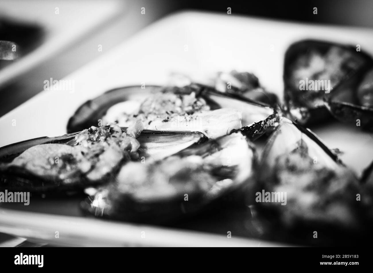 marinated shells with lemon juice & fresh spices Stock Photo - Alamy