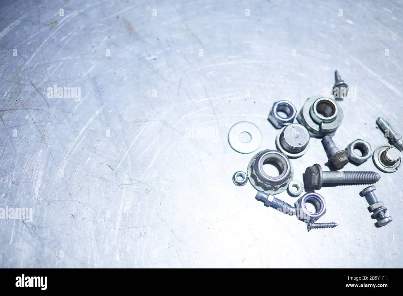 Horizontal high angle flat lay shot of stainless nuts and other details ...