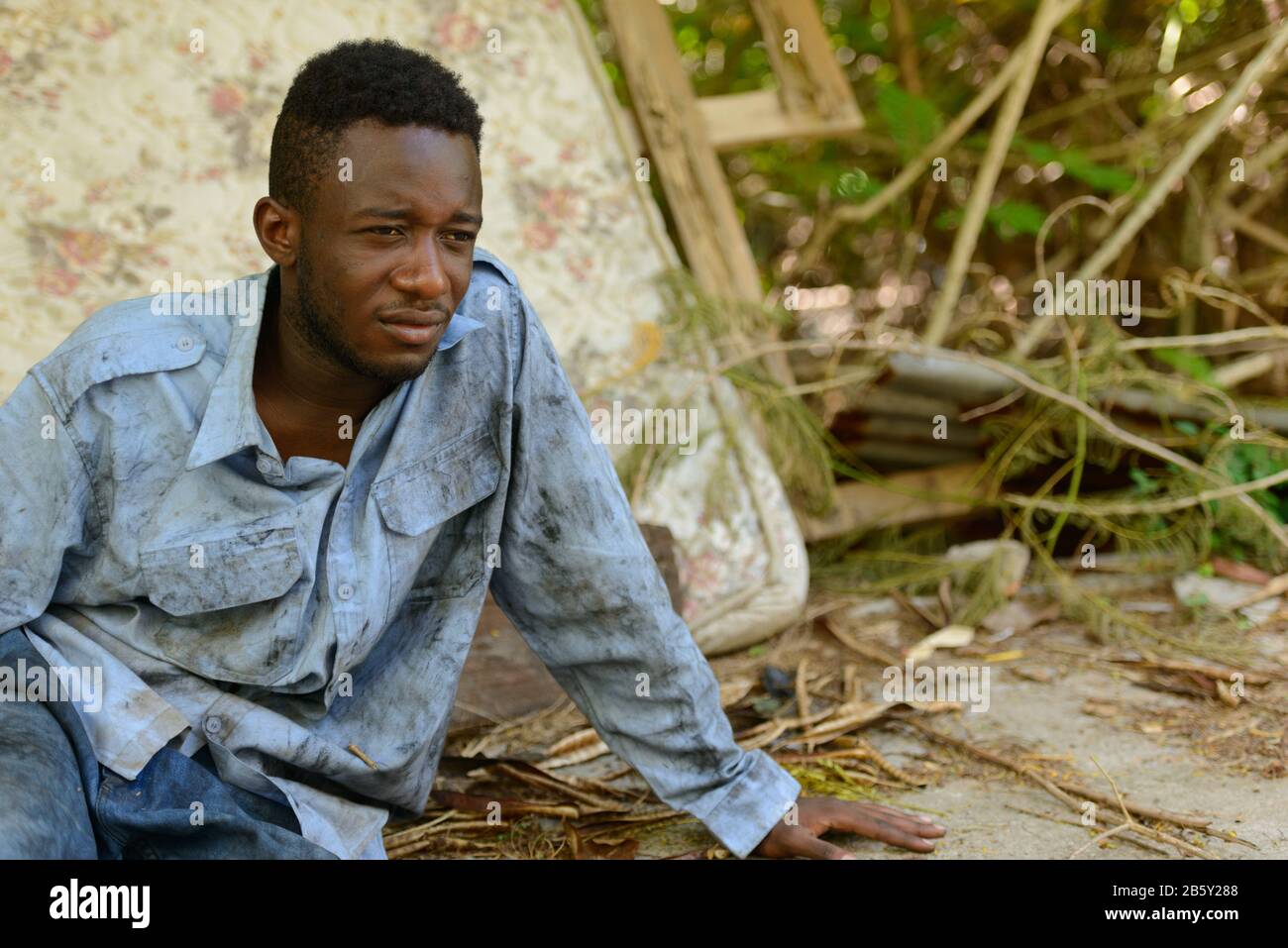 Young homeless African man in the streets Stock Photo - Alamy