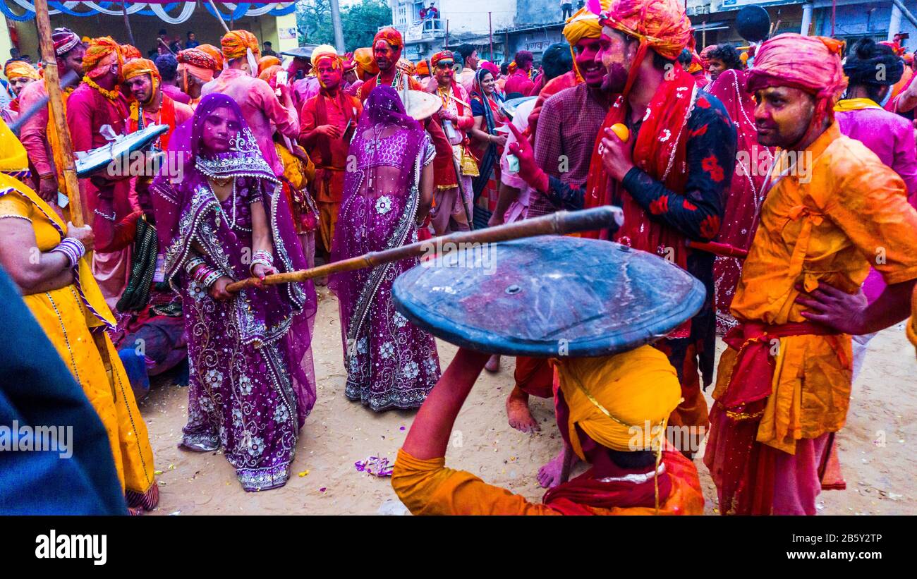 People celebrating lathmar holi in nand gaon Stock Photo - Alamy