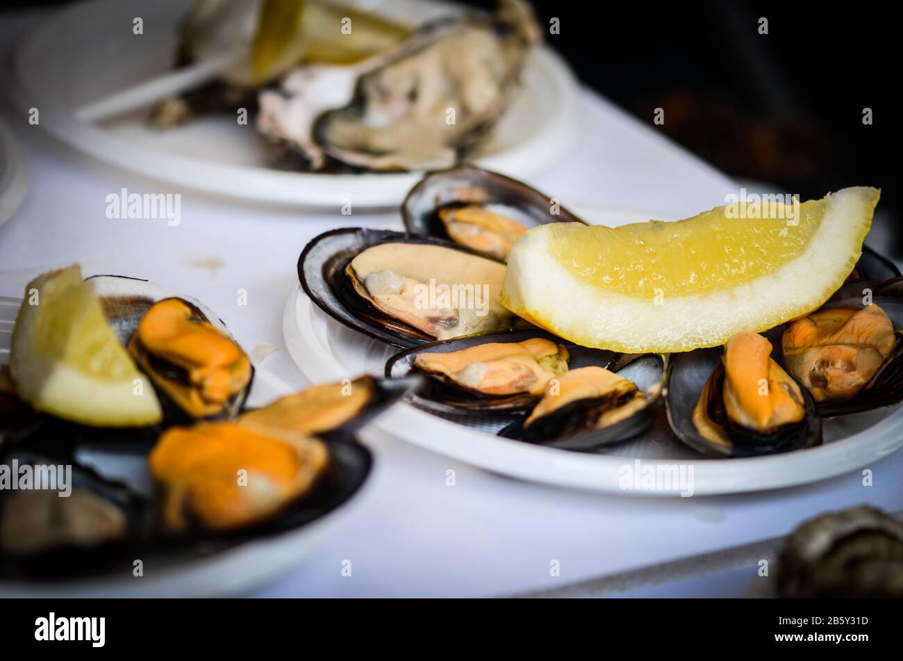marinated shells with lemon juice & fresh spices Stock Photo - Alamy
