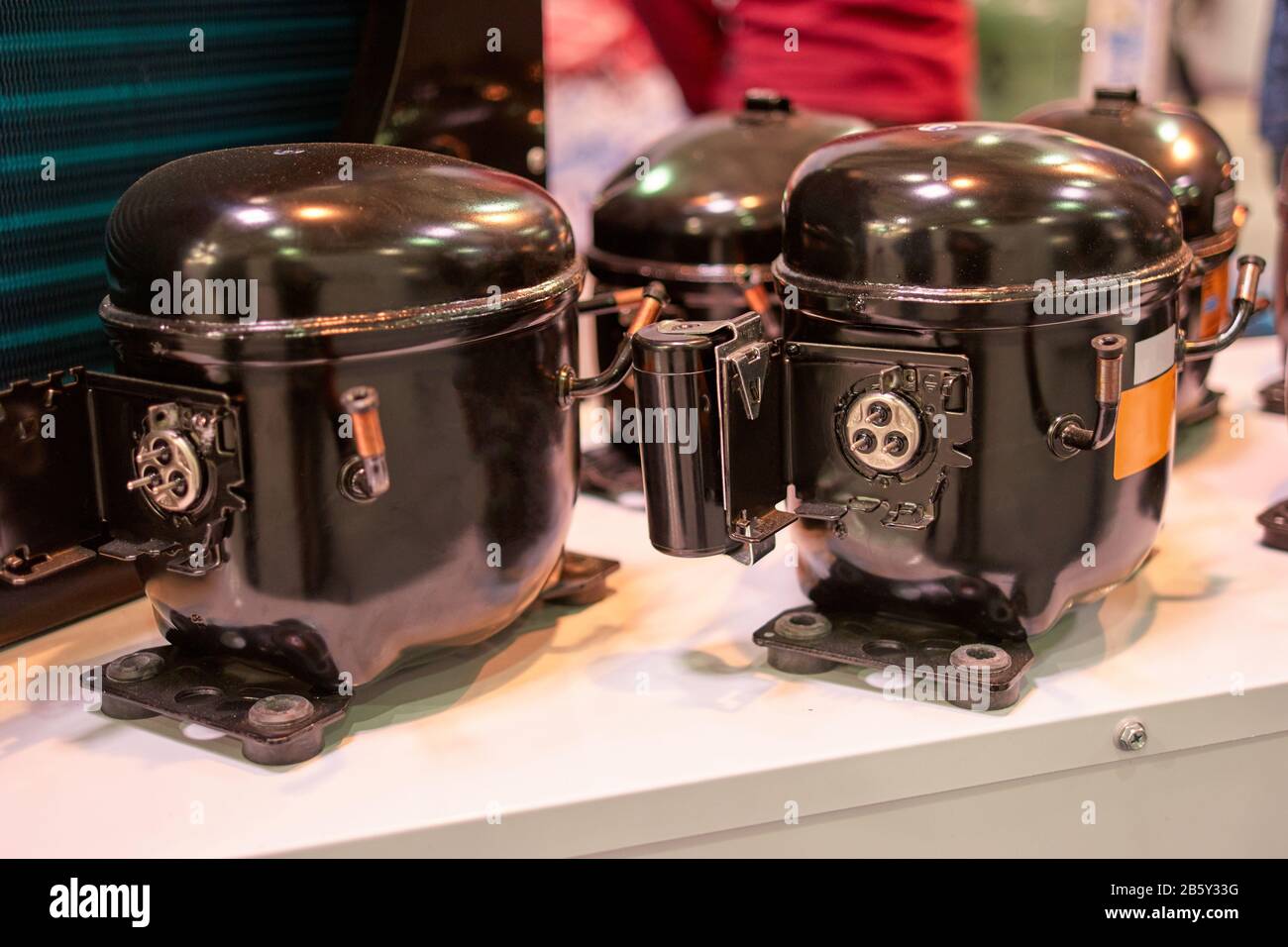 Close up black refrigerator compressors Stock Photo - Alamy