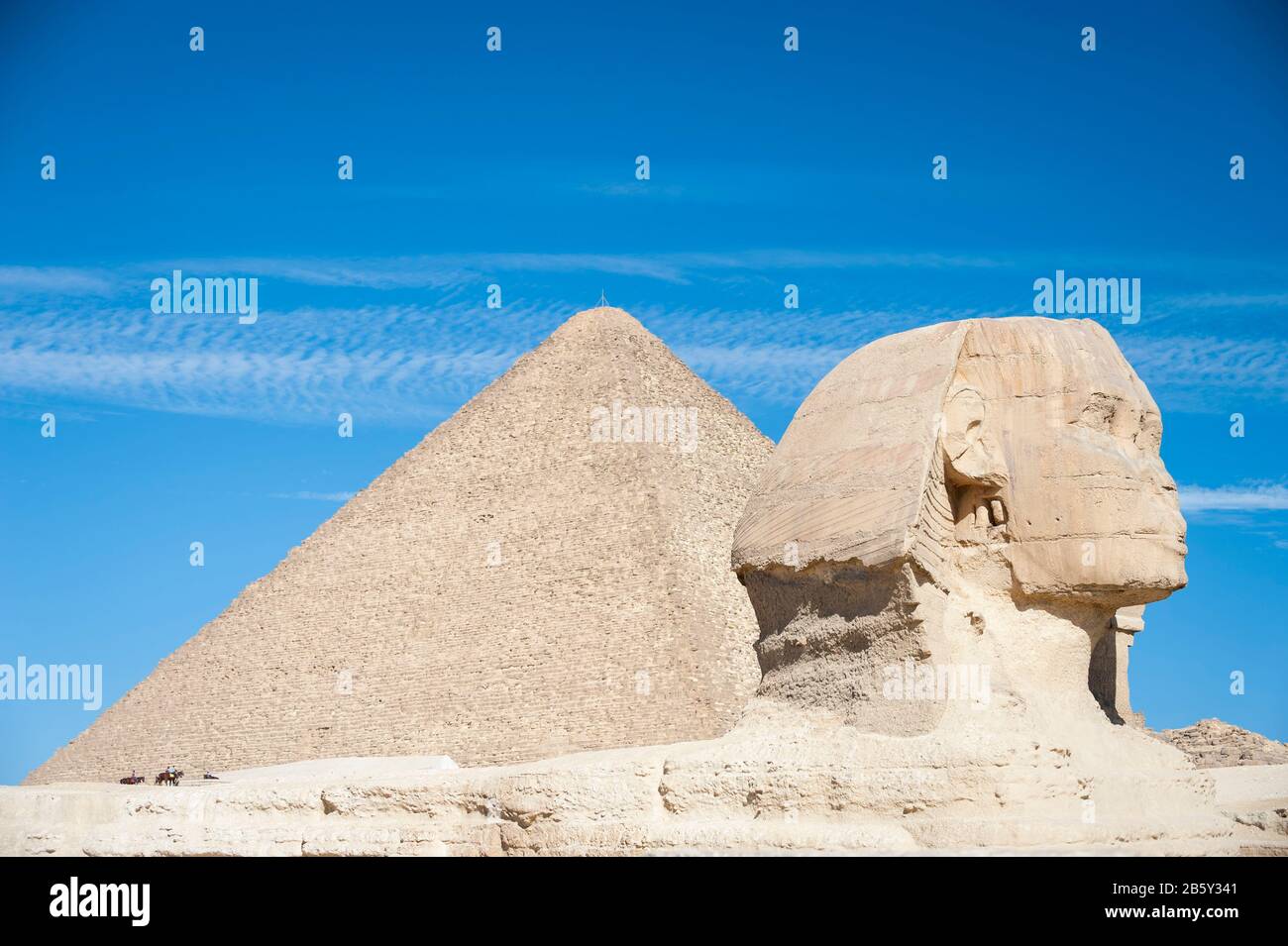 Bright sunny view of the crumbling profile of the Great Sphinx of Giza ...