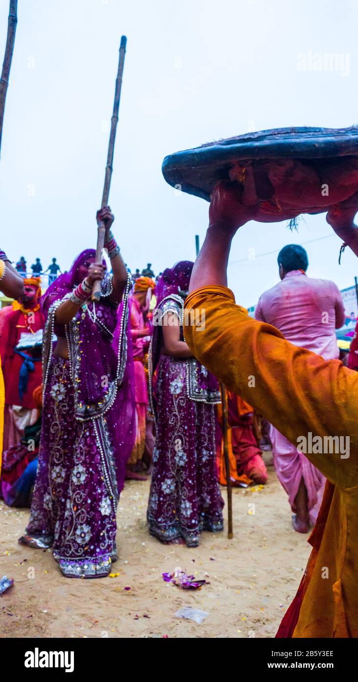 People celebrating lathmar holi in nand gaon Stock Photo - Alamy