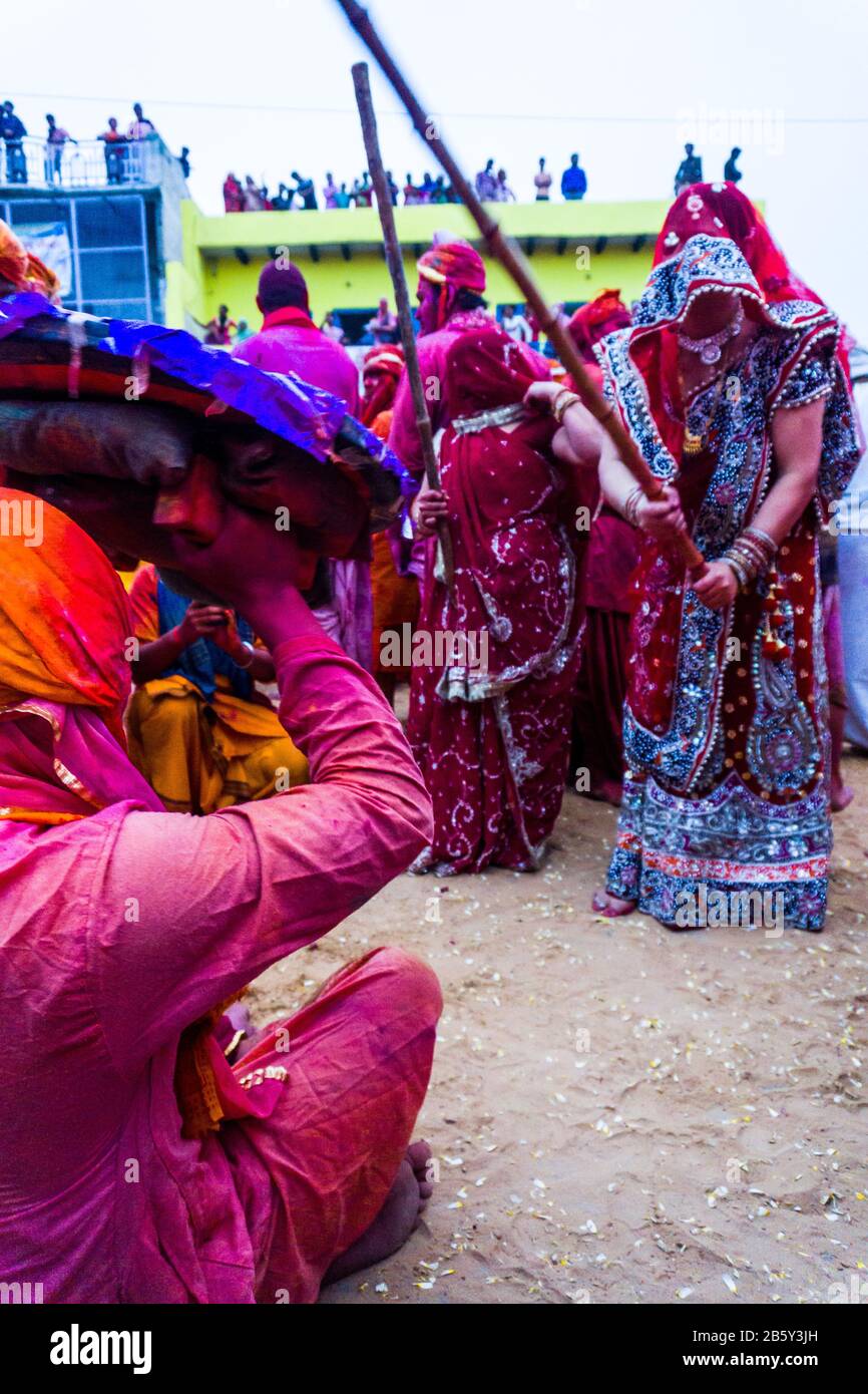 People celebrating lathmar holi in nand gaon Stock Photo - Alamy