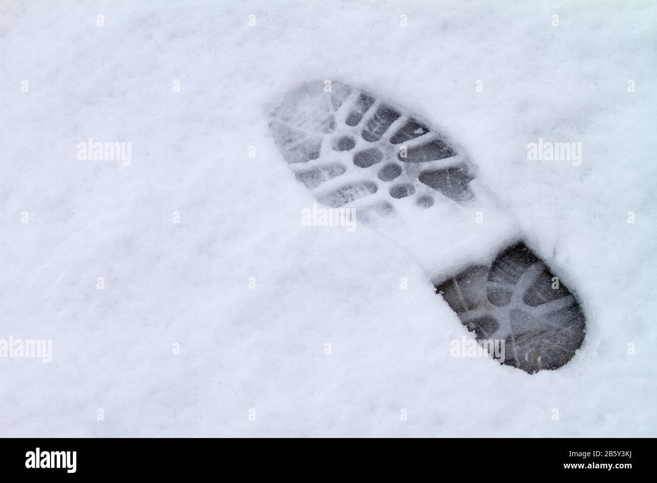 footprint over snow Stock Photo - Alamy