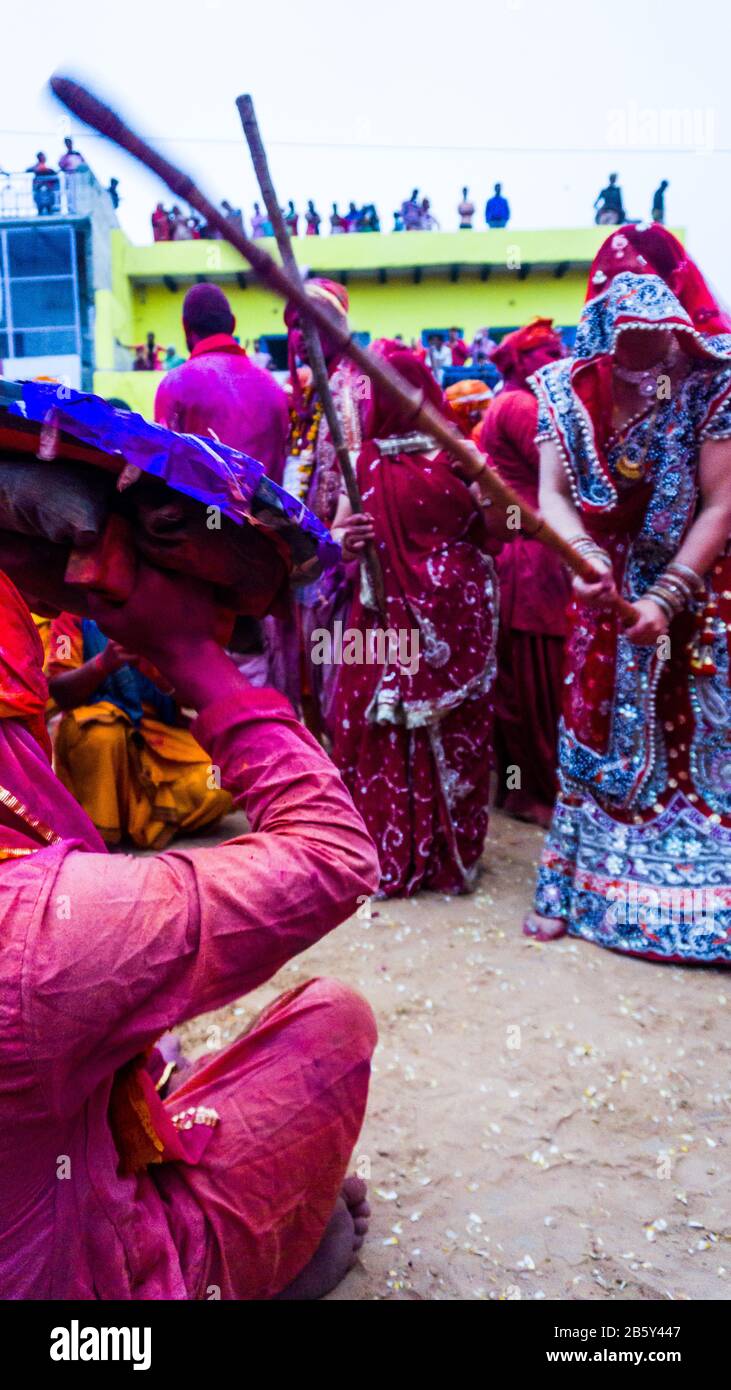 People celebrating lathmar holi in nand gaon Stock Photo - Alamy
