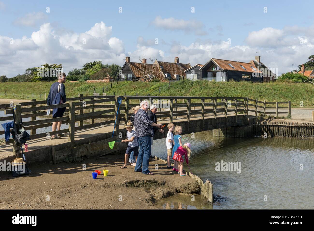 Summer scene in the seaside resort of Walberswick, Suffolk, UK; family ...