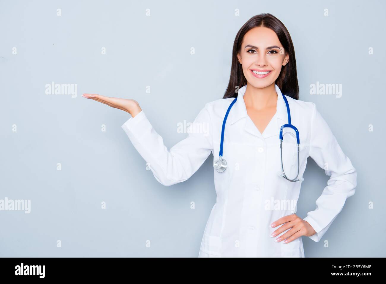 Young happy doctor making presentation of new option Stock Photo - Alamy
