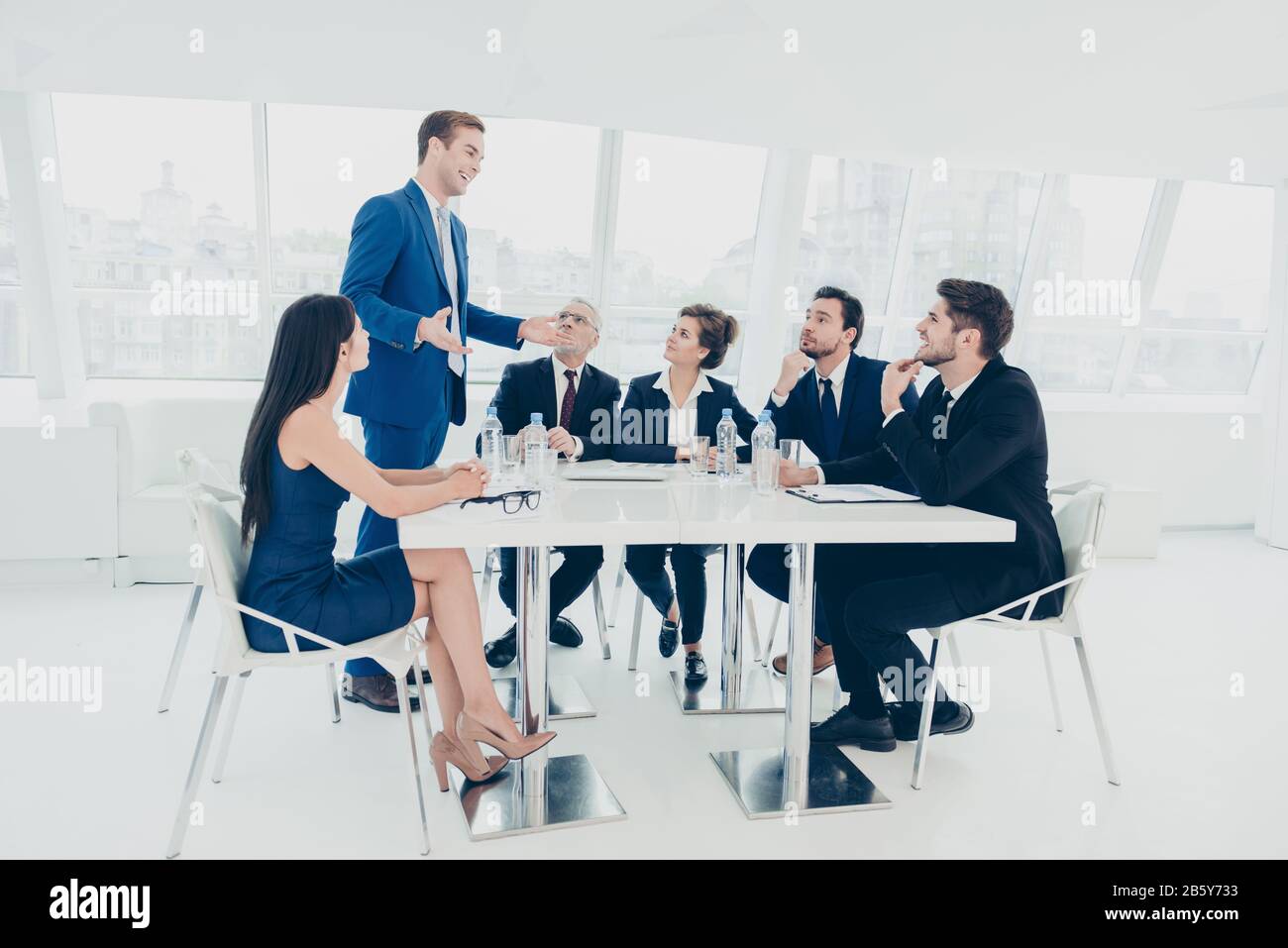 Young manager telling his ideas about project to colleagues Stock Photo ...