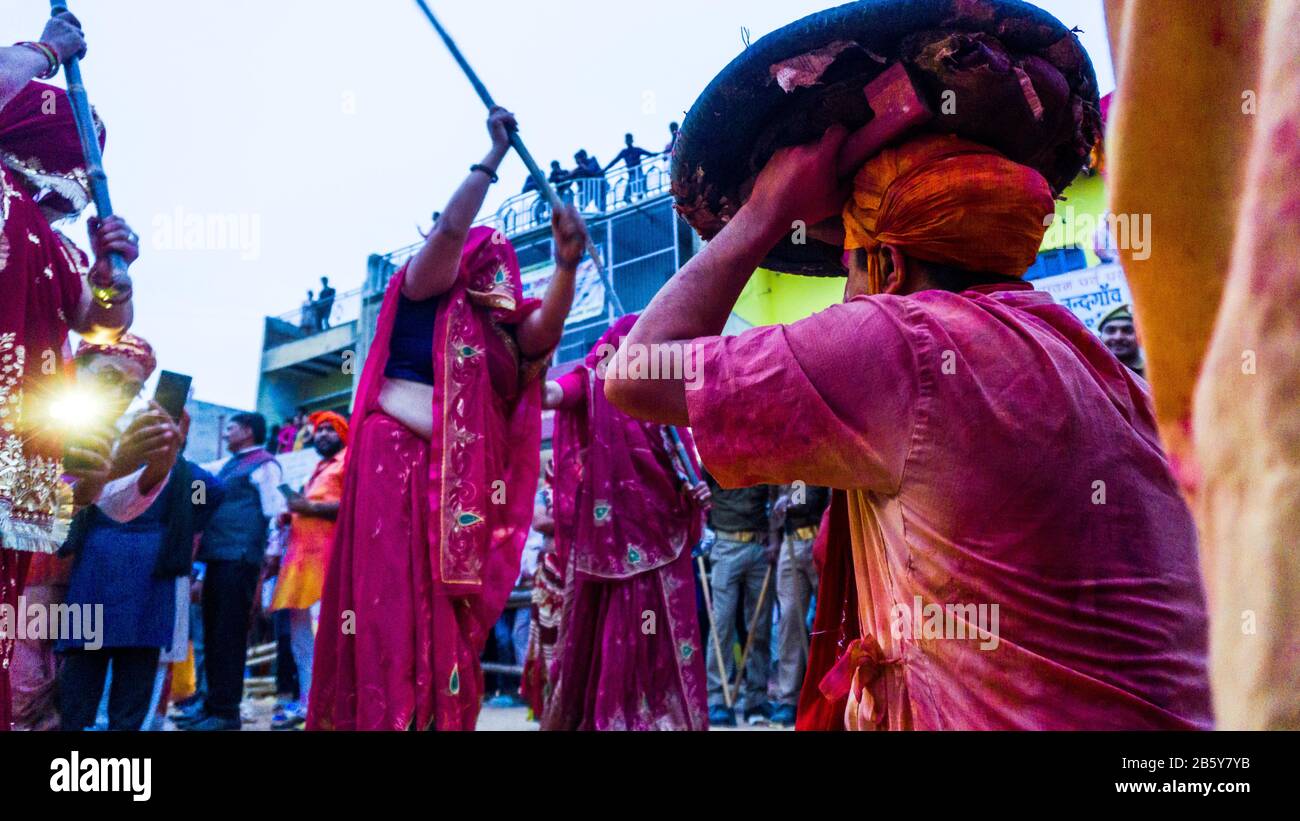 People celebrating lathmar holi in nand gaon Stock Photo - Alamy