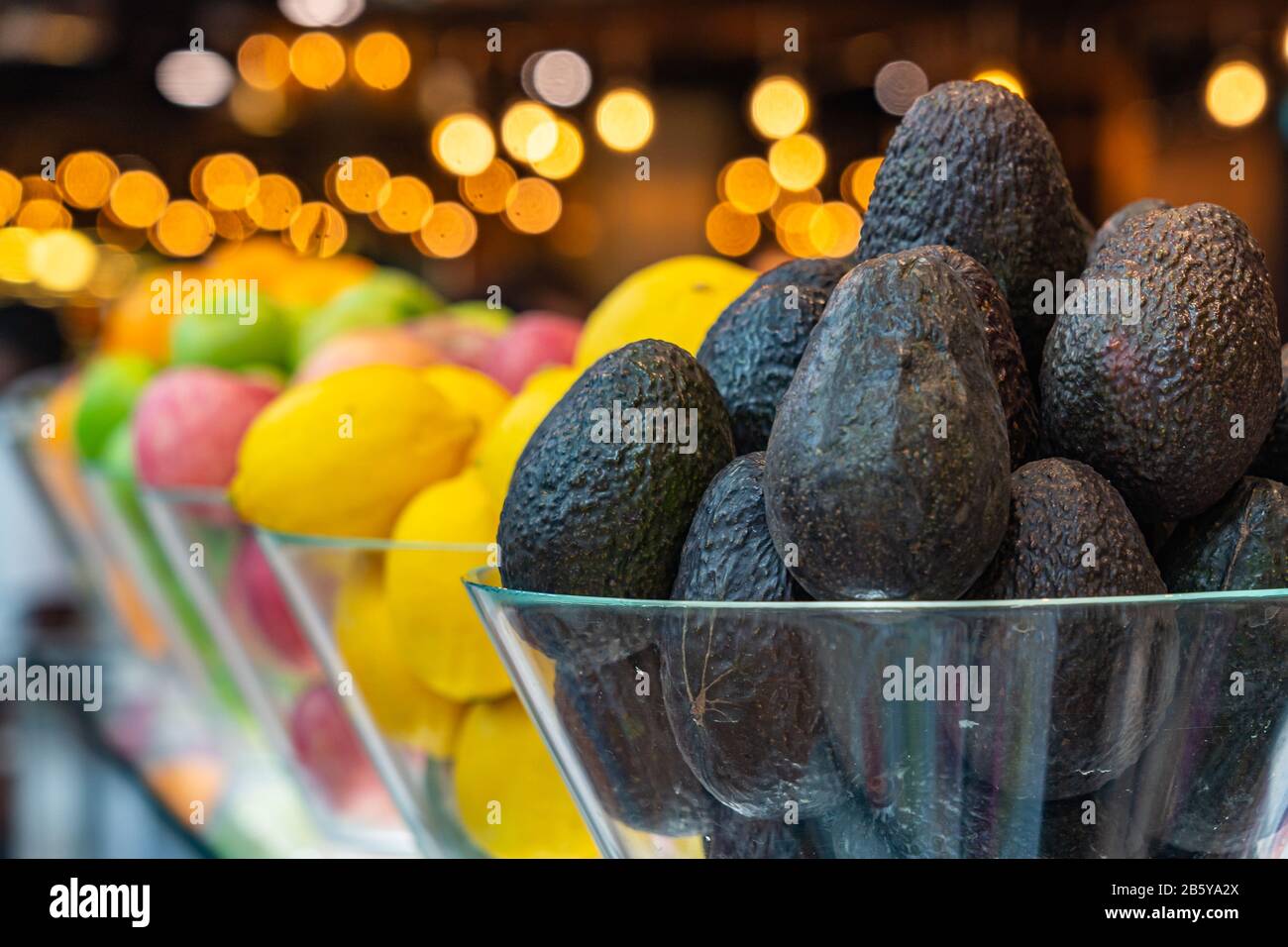 Fresh avocados and other fruits displayed at fancy juice stand Stock ...