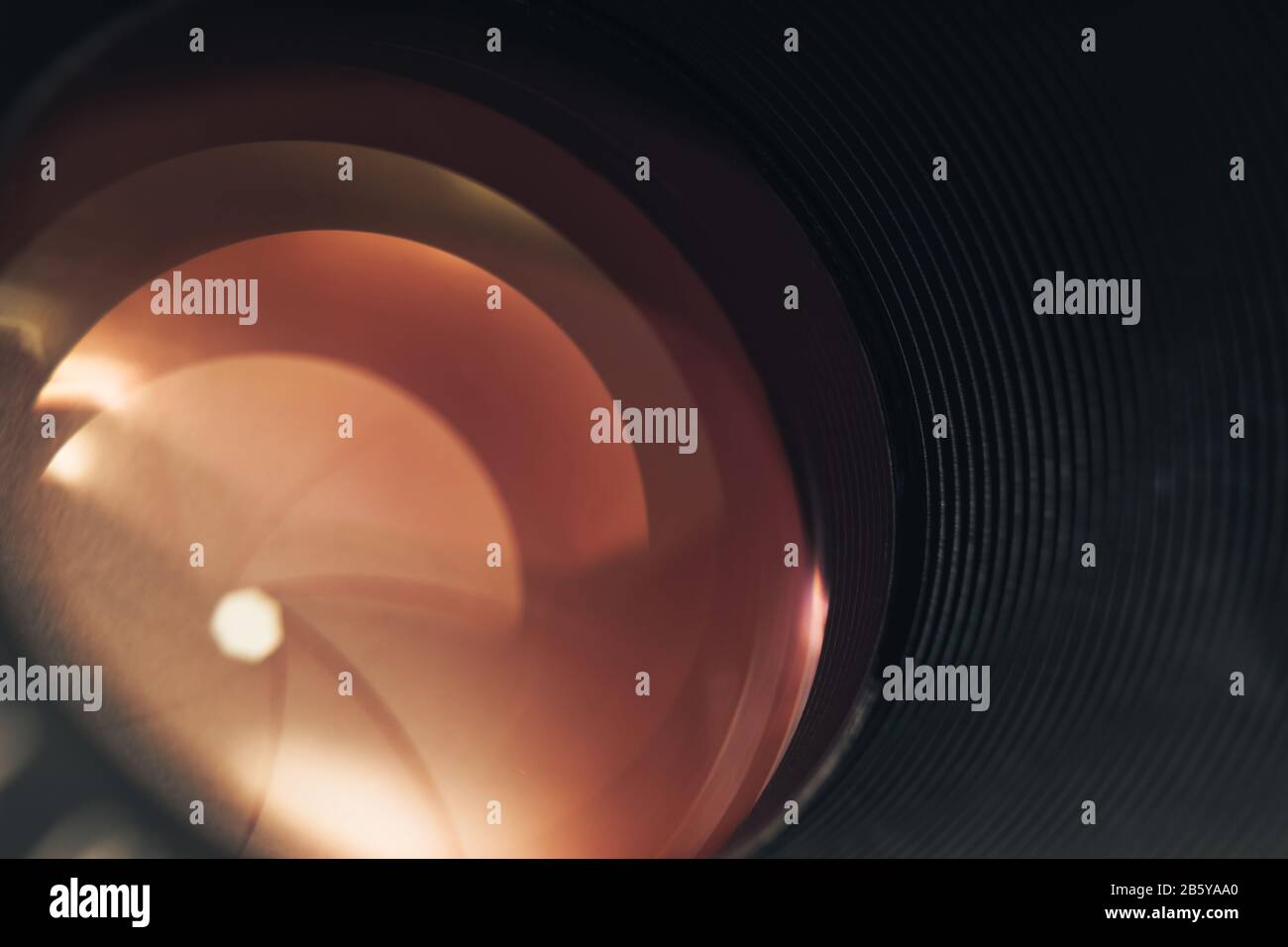 Beautiful camera lens with orange light of glass. Background pattern ...