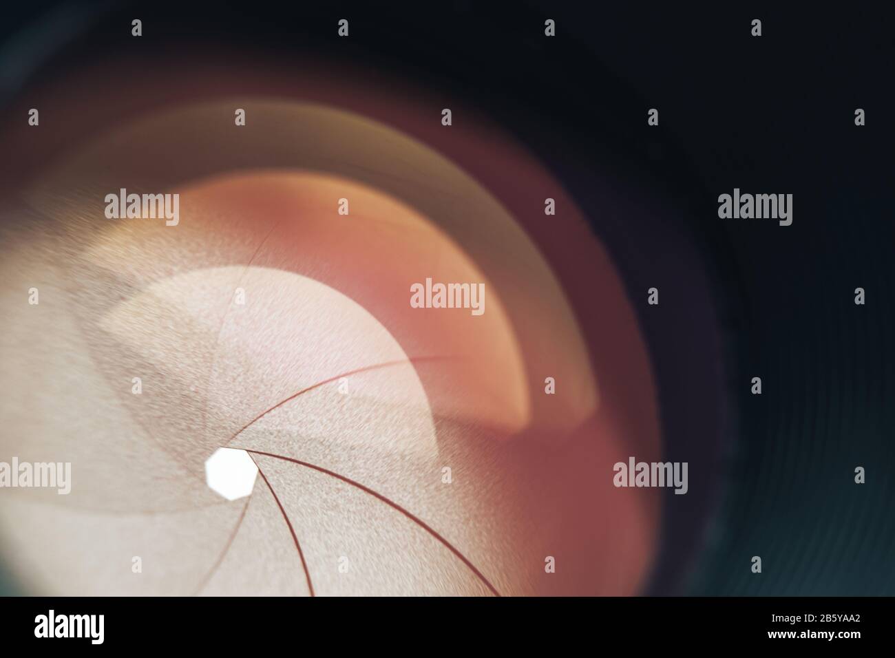 Beautiful camera lens with orange light of glass. Background pattern ...