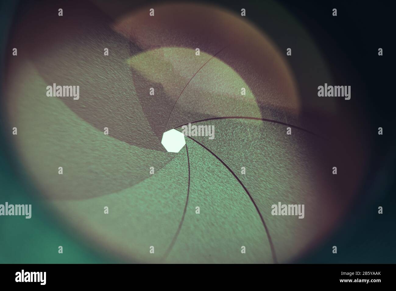 Beautiful camera lens with green light of glass. Background pattern for ...