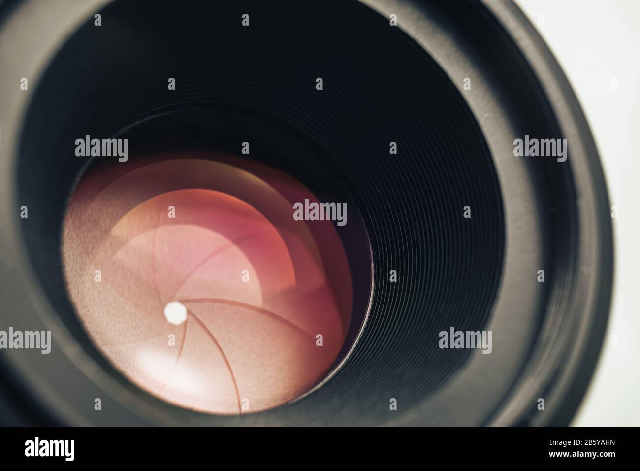 Beautiful camera lens with pink light of glass. Background pattern for ...