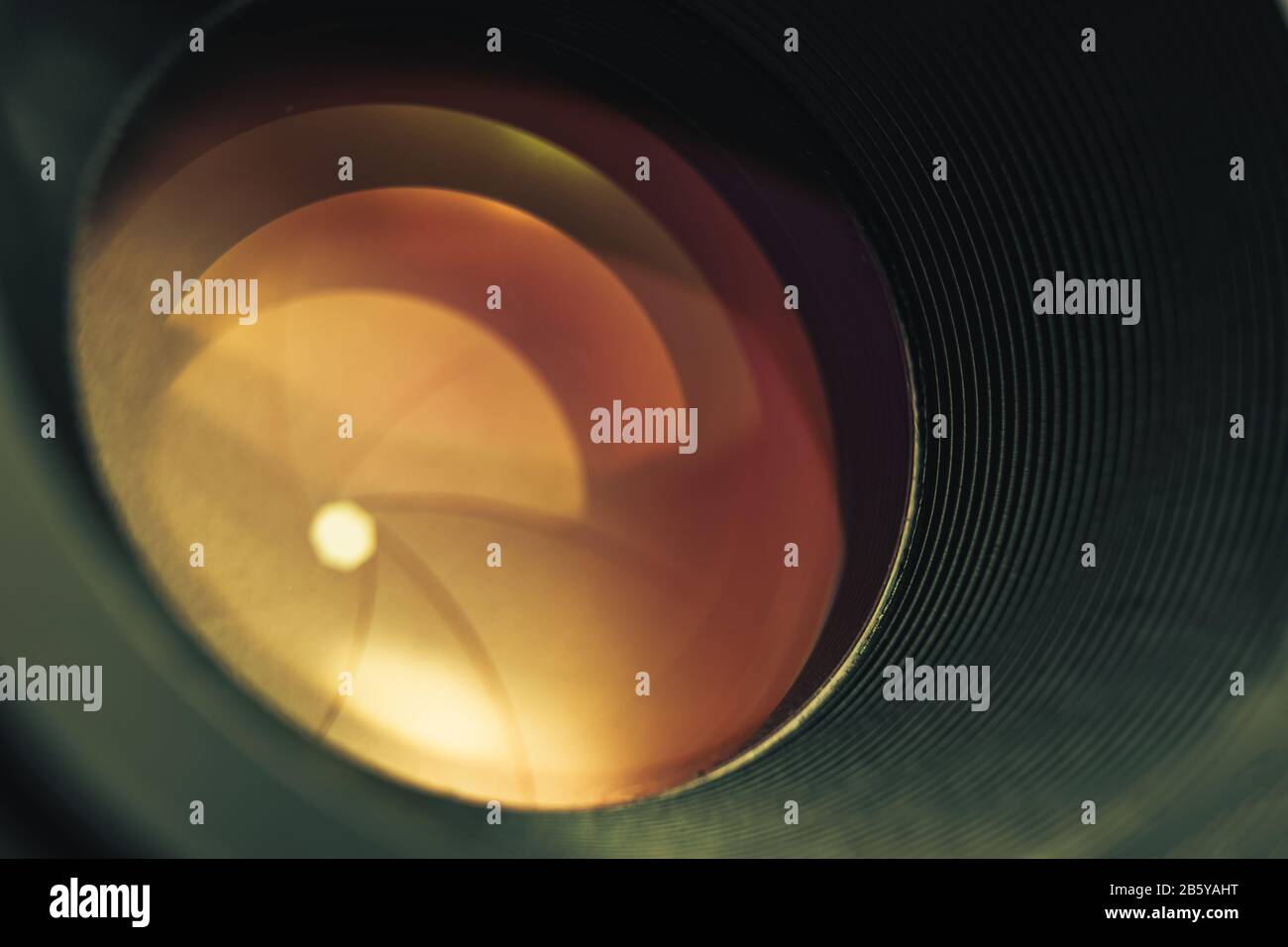 Beautiful camera lens with orange light of glass. Background pattern ...