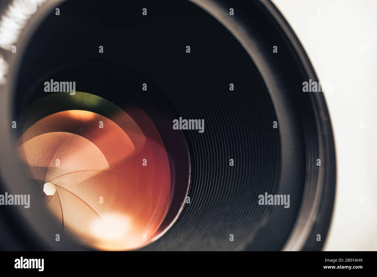Beautiful camera lens with orange light of glass. Background pattern ...