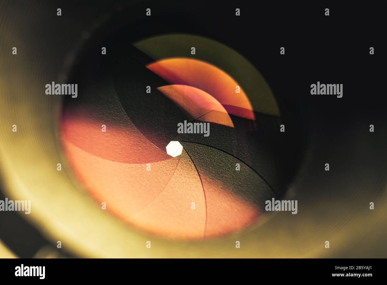 Beautiful camera lens with orange light of glass. Background pattern ...