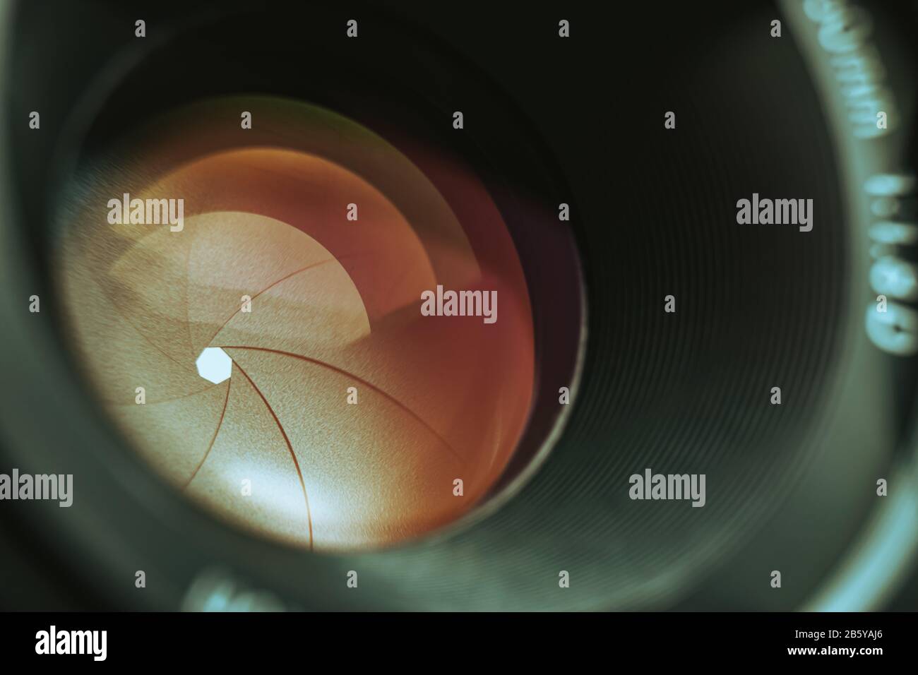 Beautiful camera lens with orange light of glass. Background pattern ...