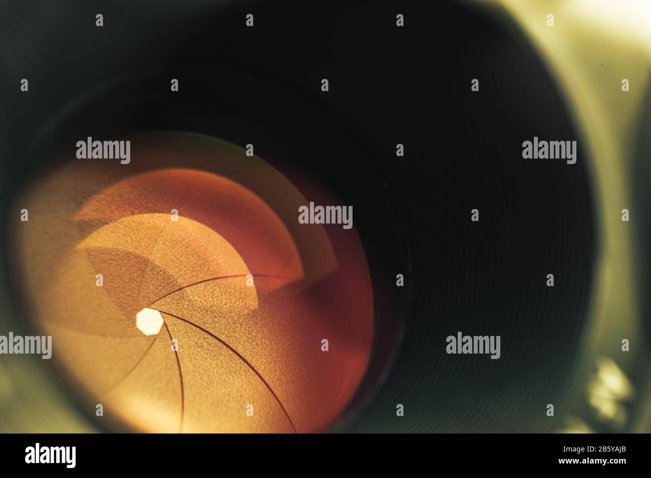 Beautiful camera lens with orange light of glass. Background pattern ...