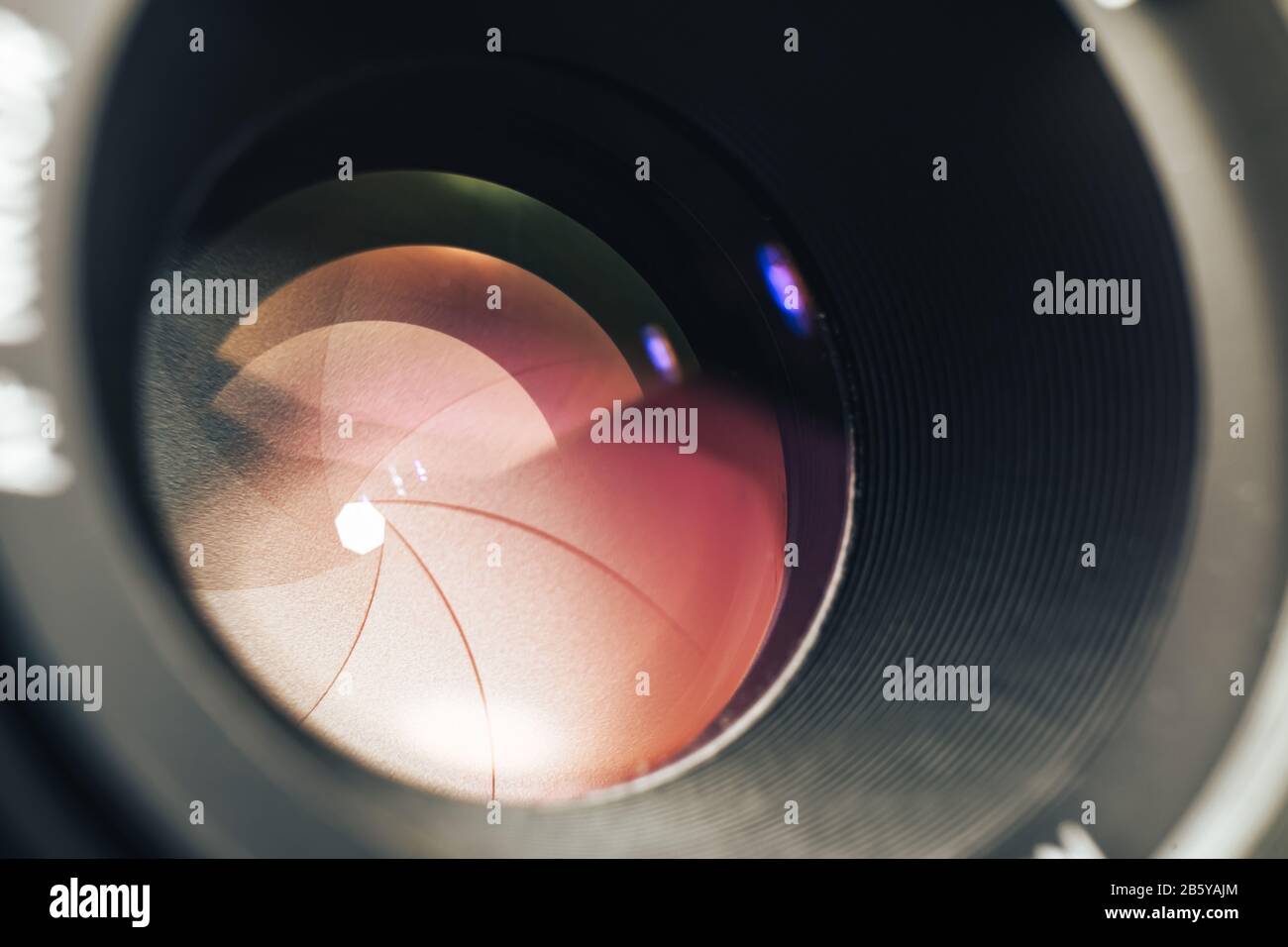Beautiful camera lens with pink light of glass. Background pattern for ...
