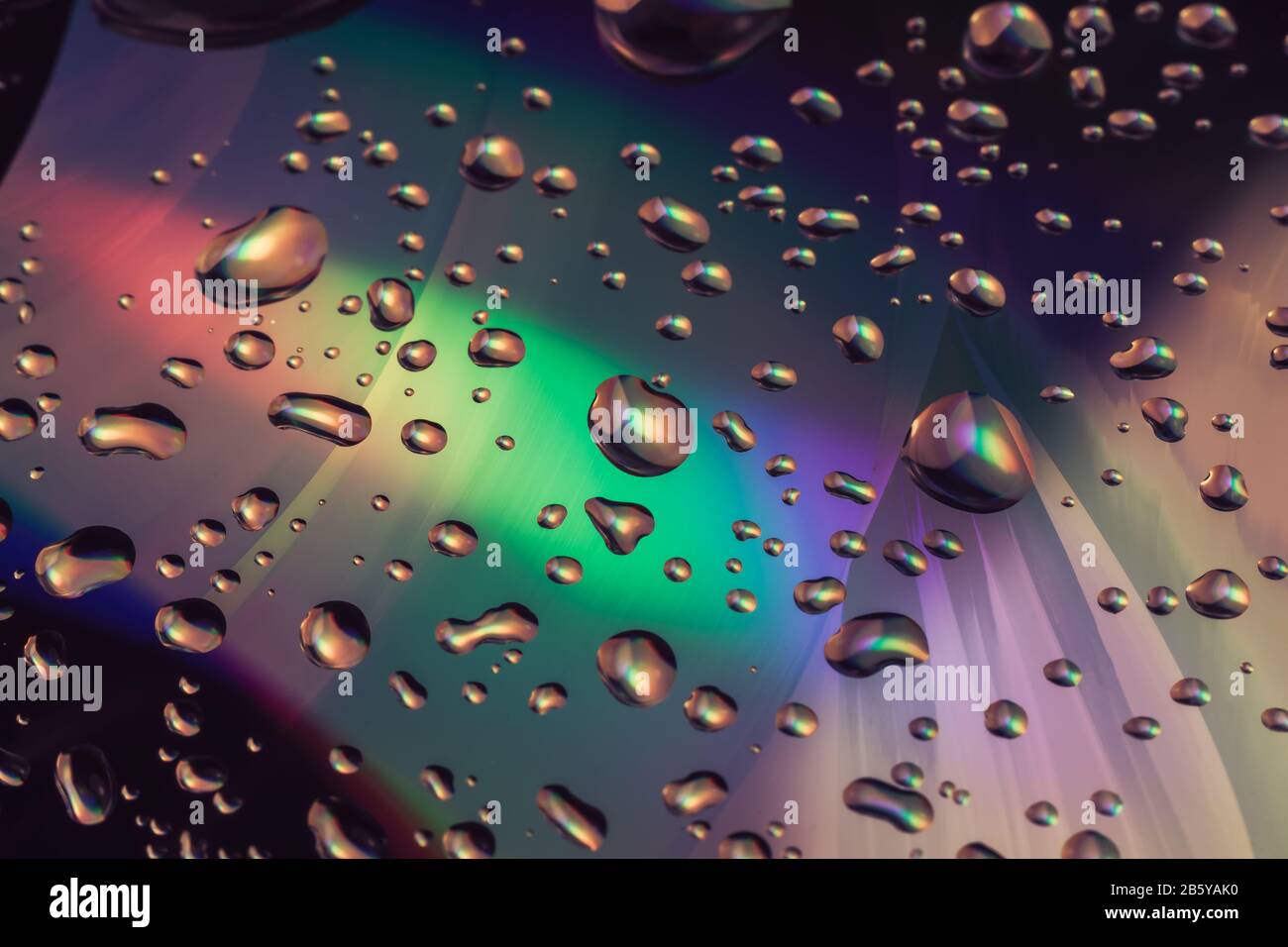 Close up beautiful abstract multi colored water drop of holographic ...